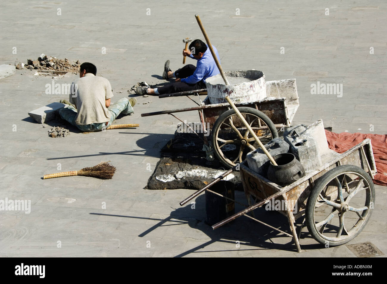 construction workers repairing the square at The Temple of Heaven ...