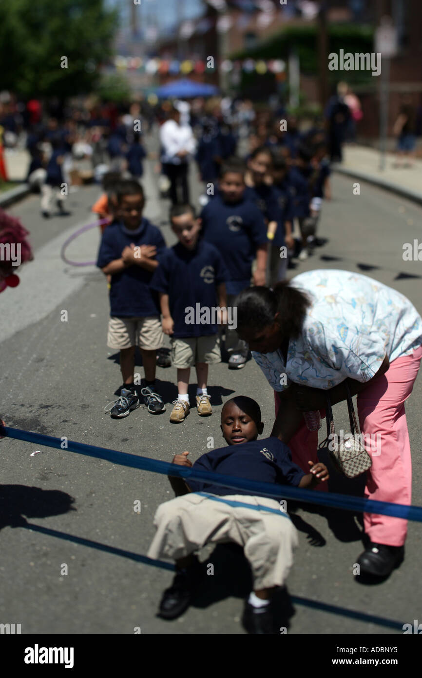 Children at a street festival doing limbo dance in New Haven ...