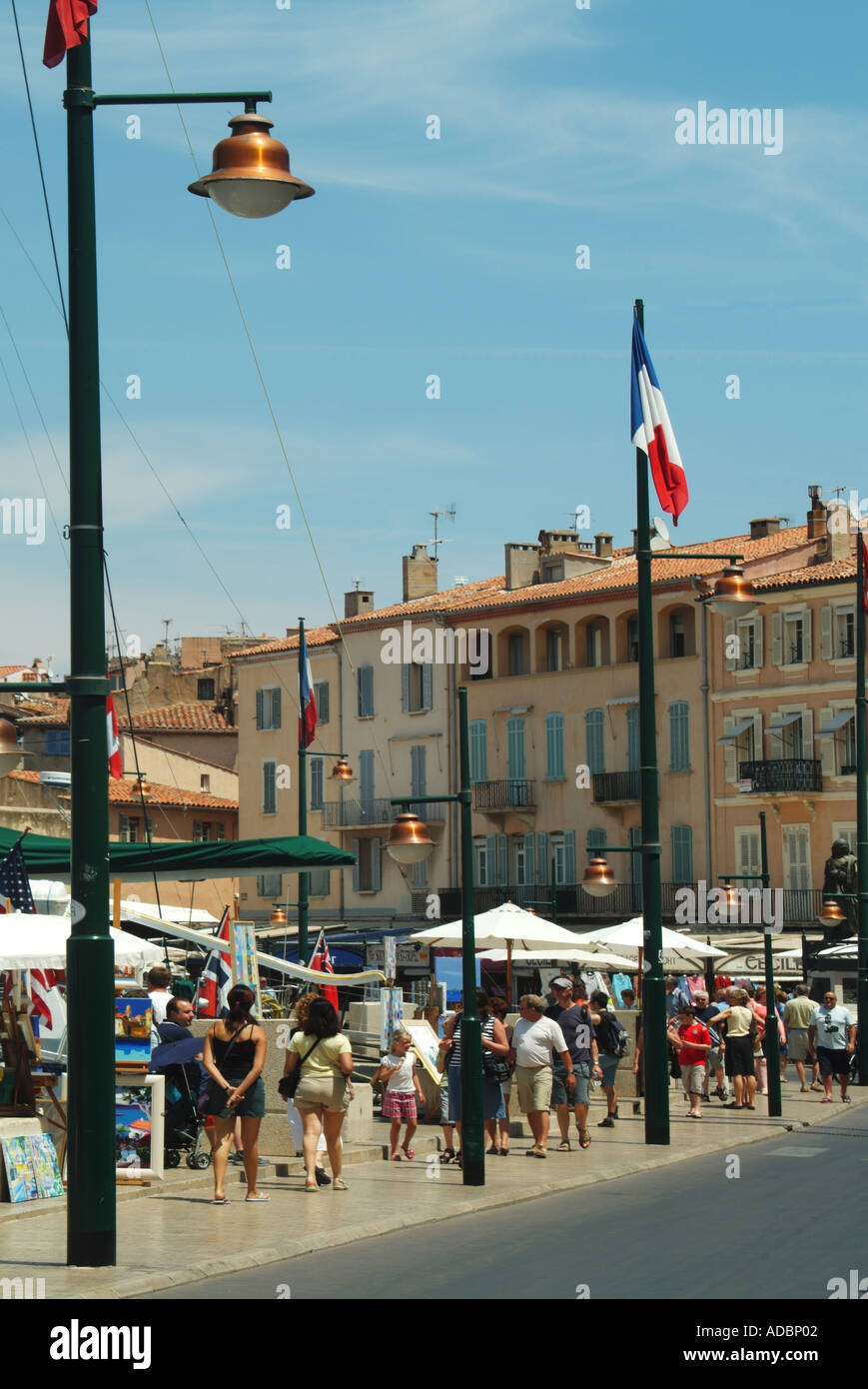 St Tropez busy waterfront artists selling pictures & tourist people ...