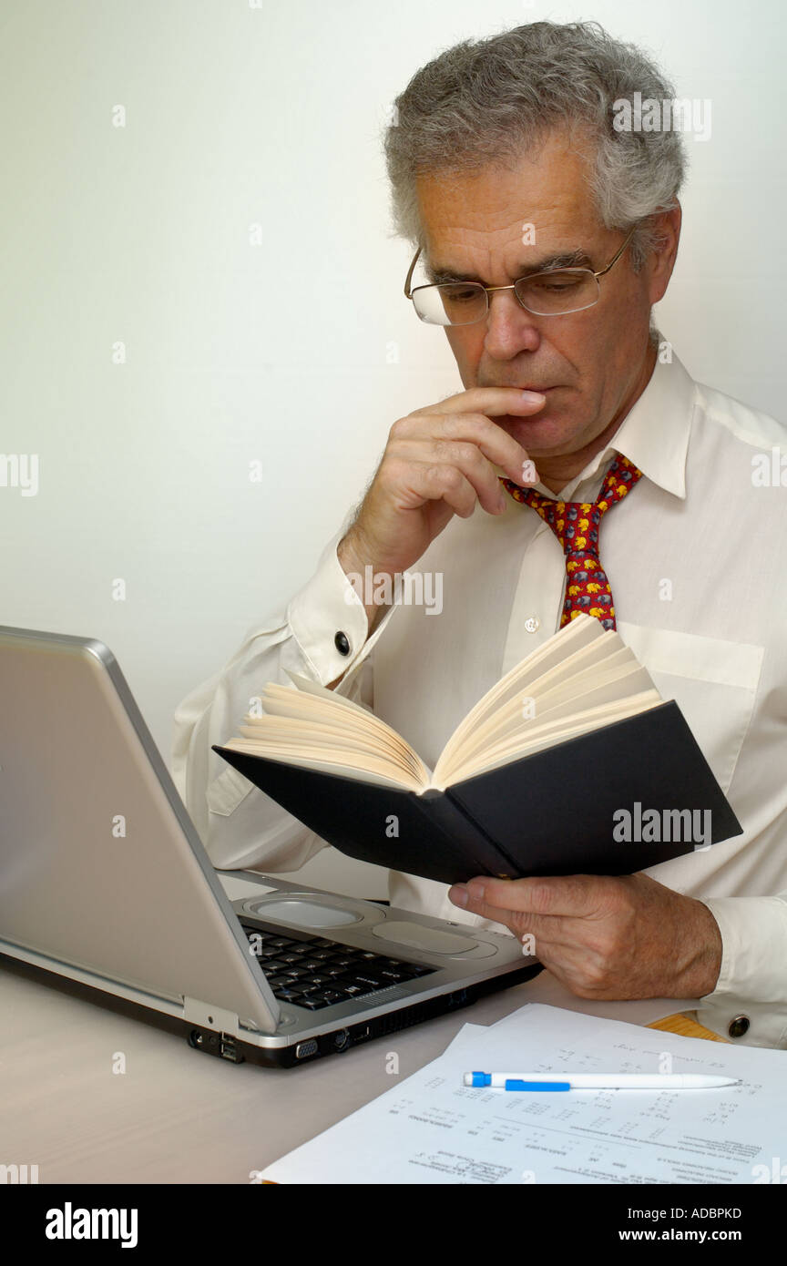 Taking a break to read Stock Photo - Alamy