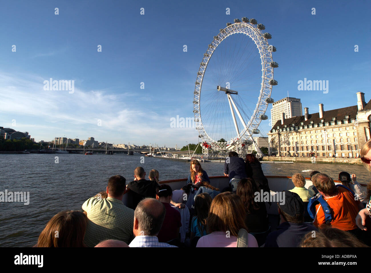 London Eye ferris wheel and River Thames Tourist cruise Boat in London ...