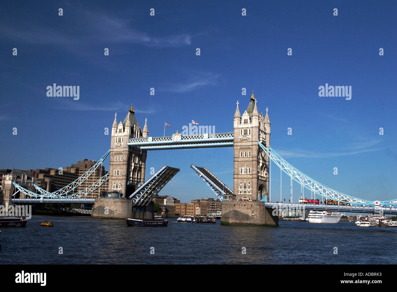 Tower Bridge opening drawbridge in London UK Stock Photo - Alamy
