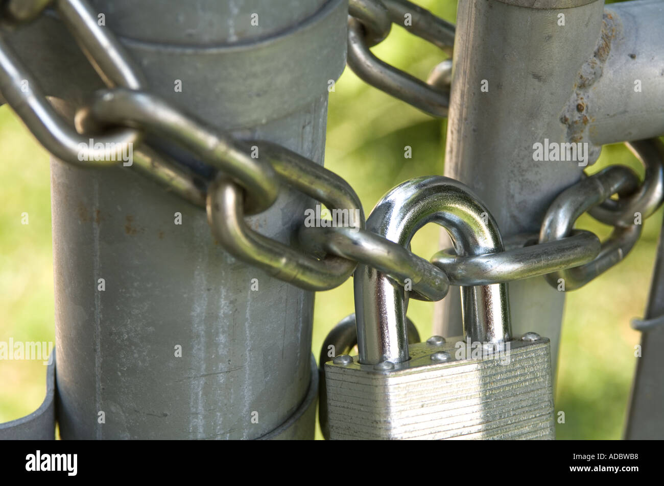 padlock and chain on fence gate at power substation Stock Photo - Alamy