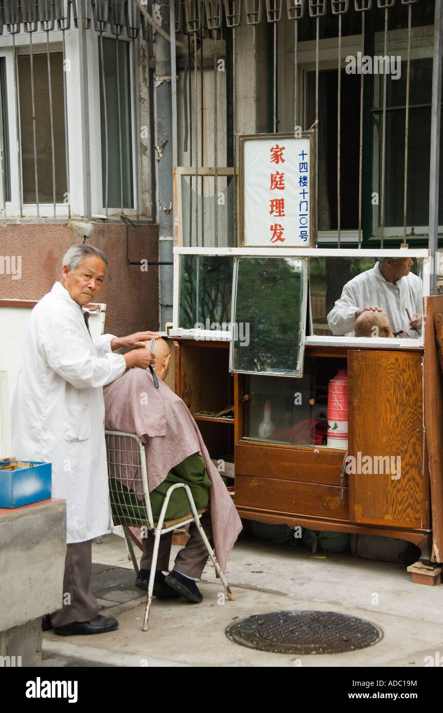 an outdoor barber shop in a residential estate Beijing China Stock ...