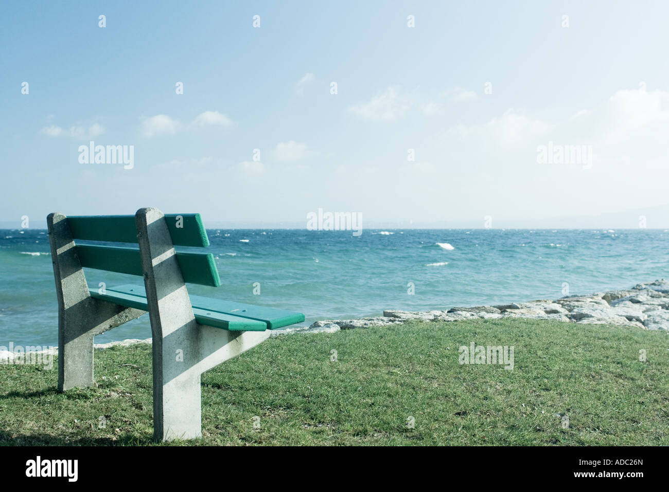 Bench overlooking coast Stock Photo - Alamy