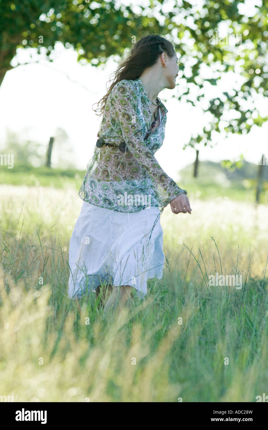 Woman running looking over shoulder hi-res stock photography and images ...