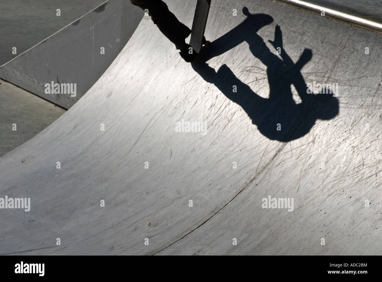 CHILD AND SHADOW OF SKATE BOARDER Stock Photo - Alamy