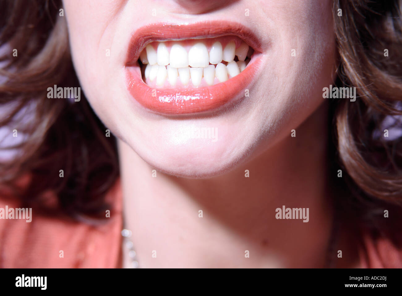 Close up of woman baring her teeth, face detail Stock Photo - Alamy