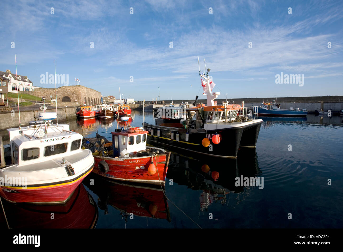 Fishing boats tied up at Seahouses harbour Seahouses Northumberland ...