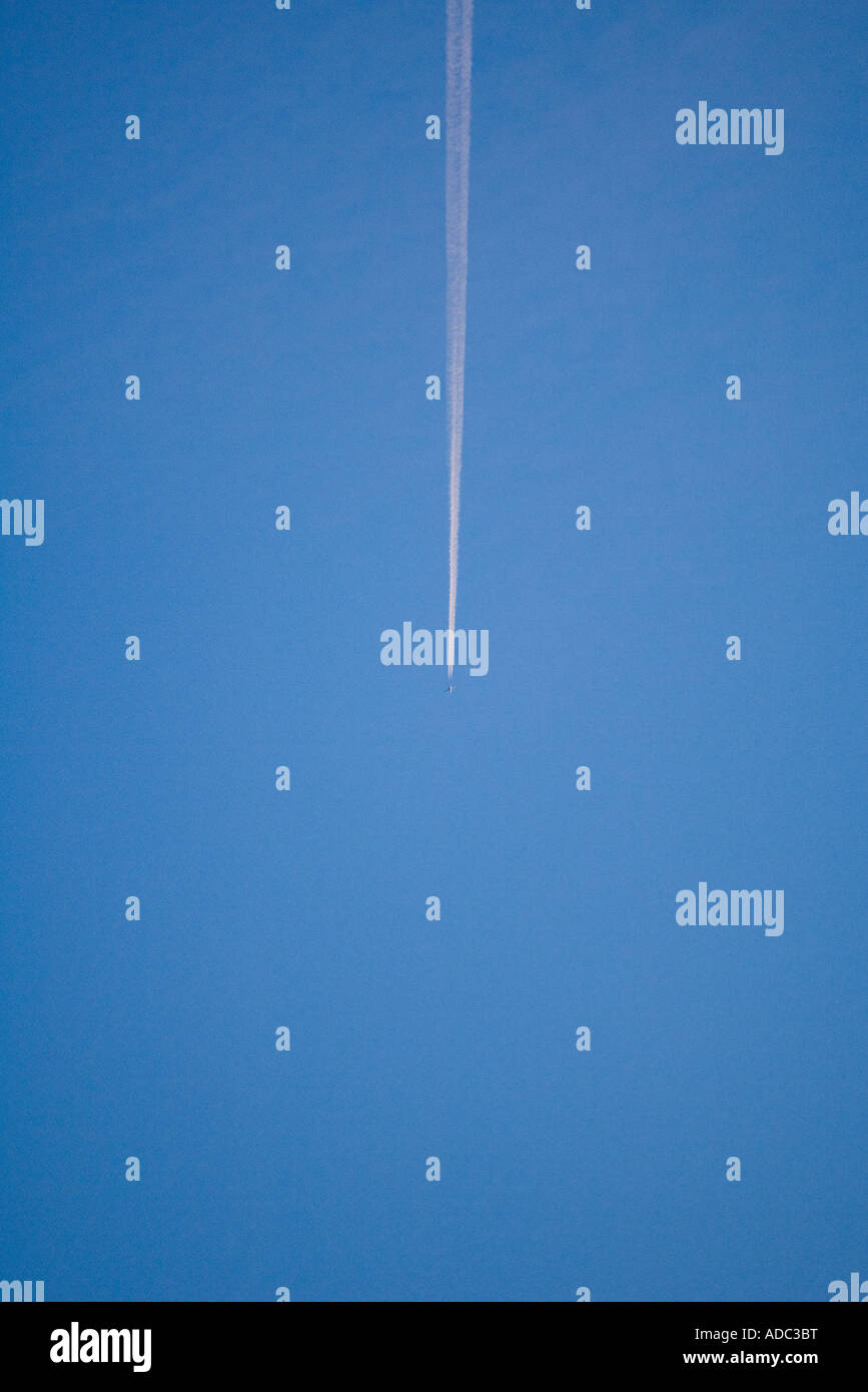 Vapor trail in blue sky Stock Photo - Alamy