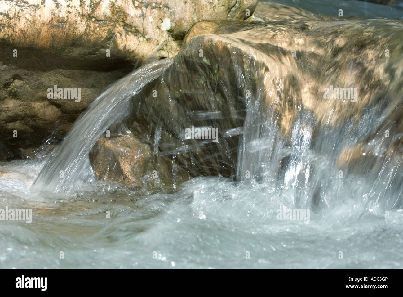 Water running over rock, close-up Stock Photo - Alamy