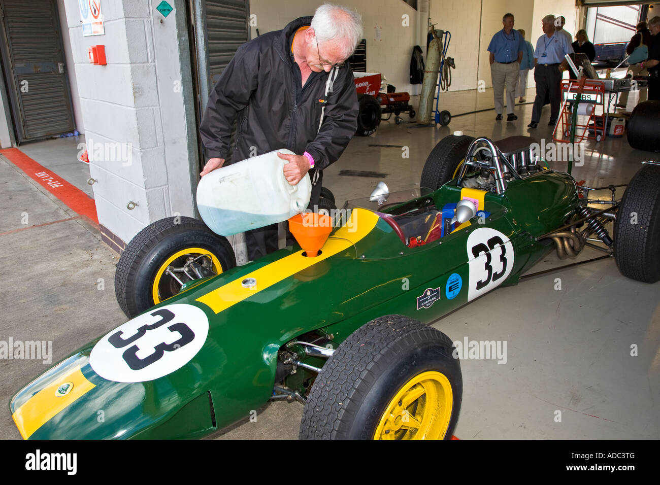 Lotus 33 single seater classic F1 racing car in the pits being filled ...