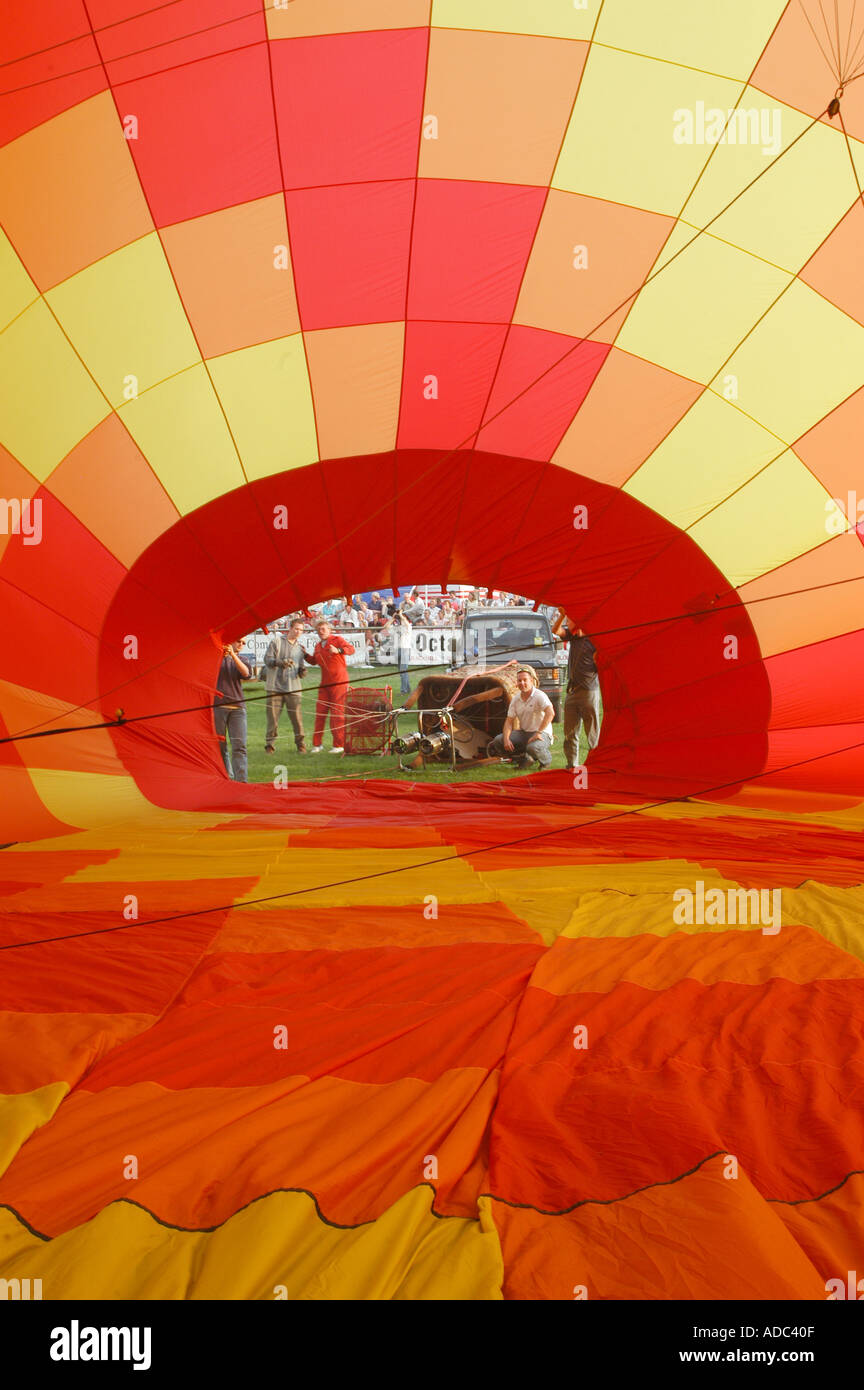 Red and yellow hot air balloon being inflated viewed from inside Stock ...