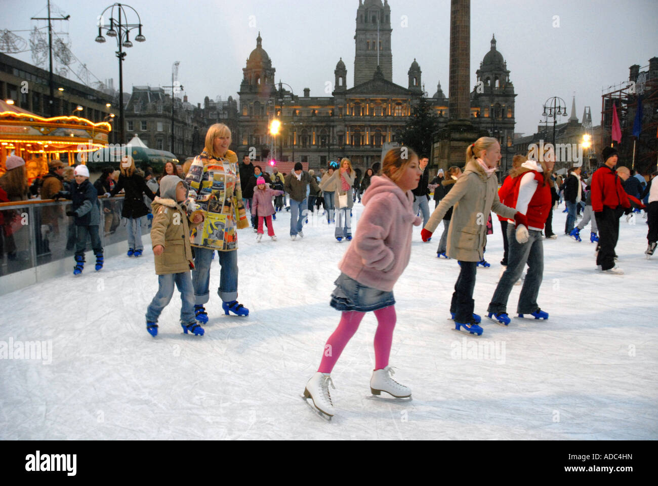 Ice Skating on Outdoor Ice Rink, George Square. City Chambers in ...