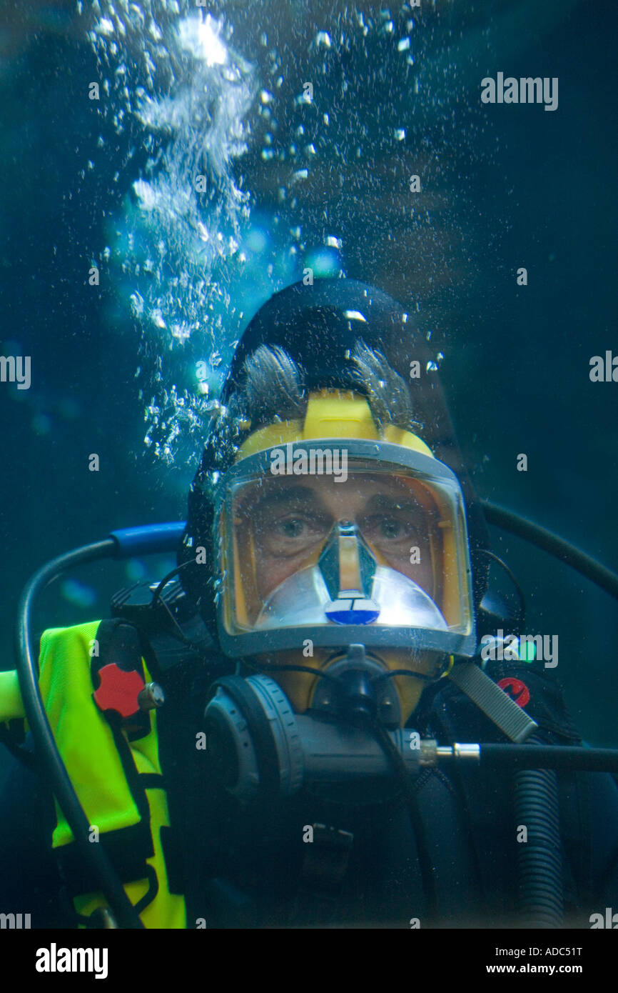 Close-up photo of a scuba diver underwater, looking through his face ...