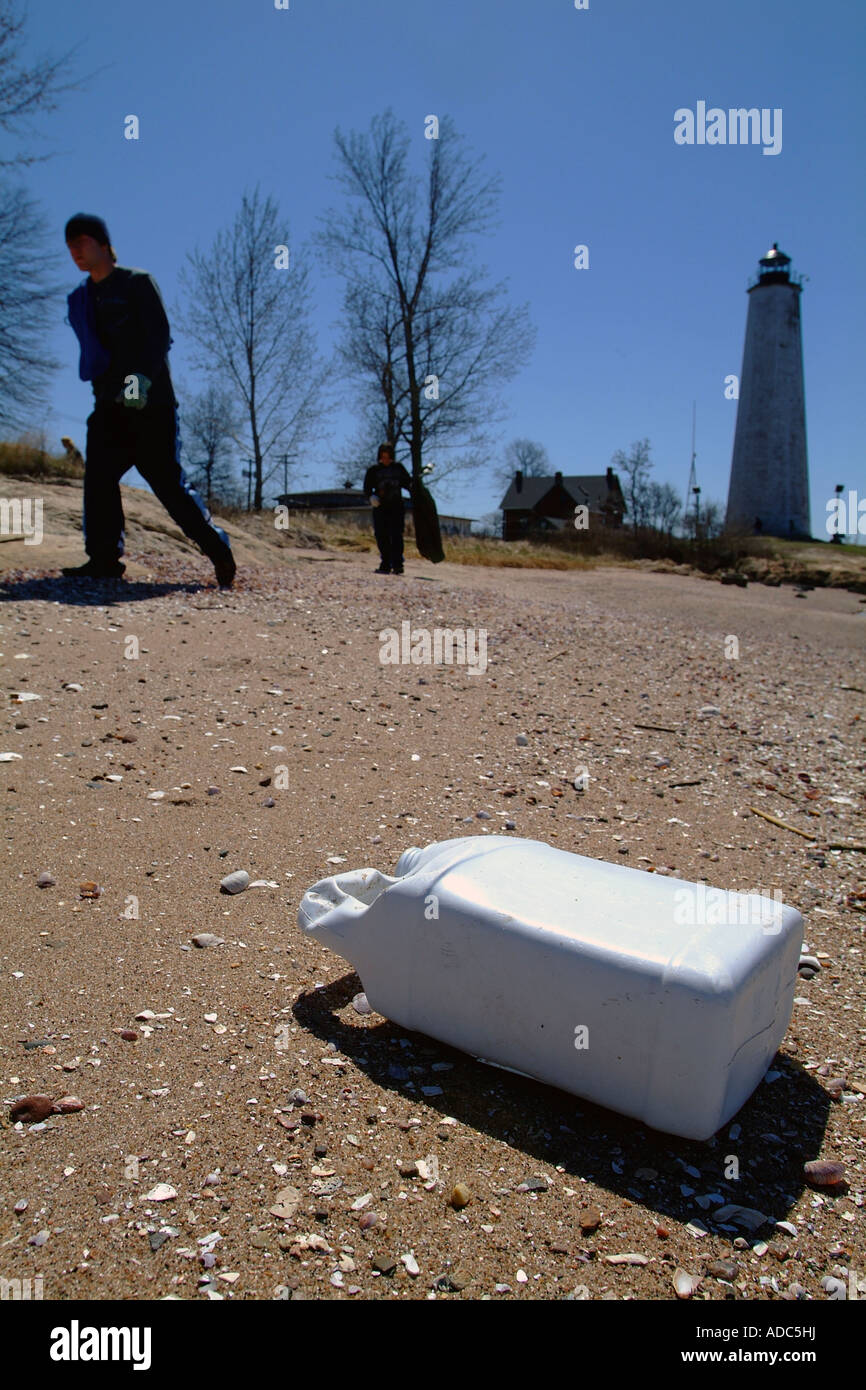 Garbage and waste on a beach plastic container washed up along beach ...