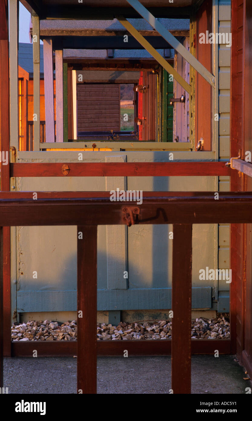 view along line / row of beach huts through verandas / patios giving ...