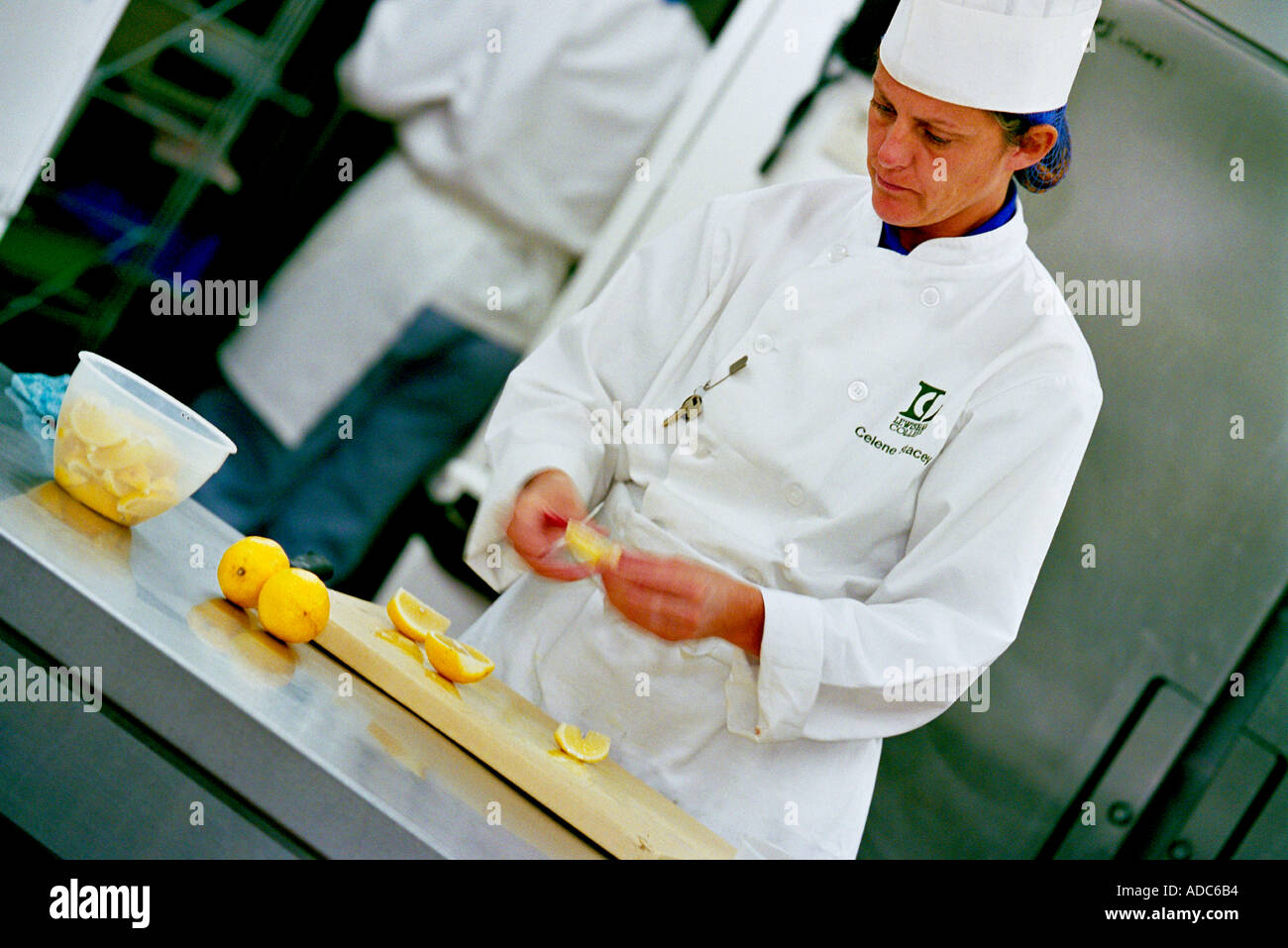 female chef preparing lemons Stock Photo - Alamy