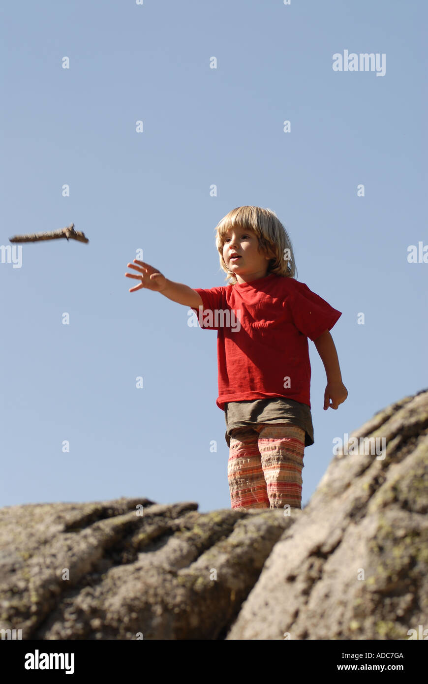 Child shoting a stick Stock Photo - Alamy