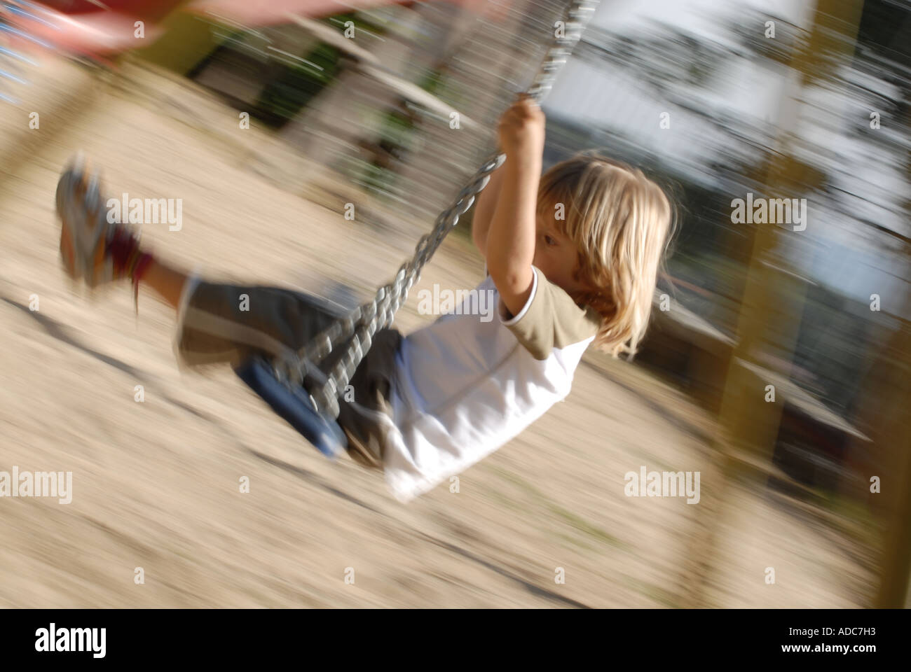 Child playing at swing Stock Photo - Alamy