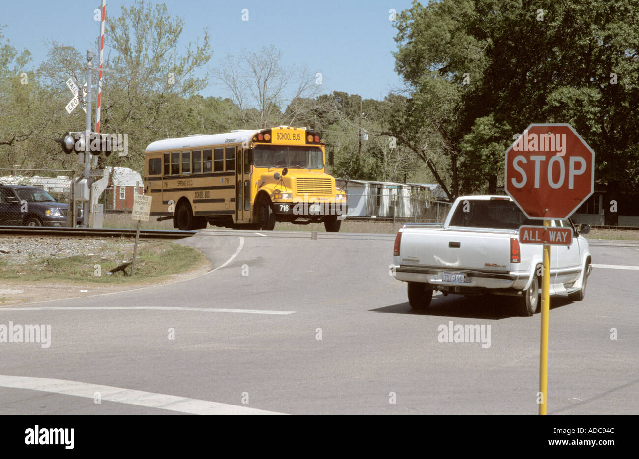 Old Town Spring Texas USA School bus on railway level crossing Railroad ...