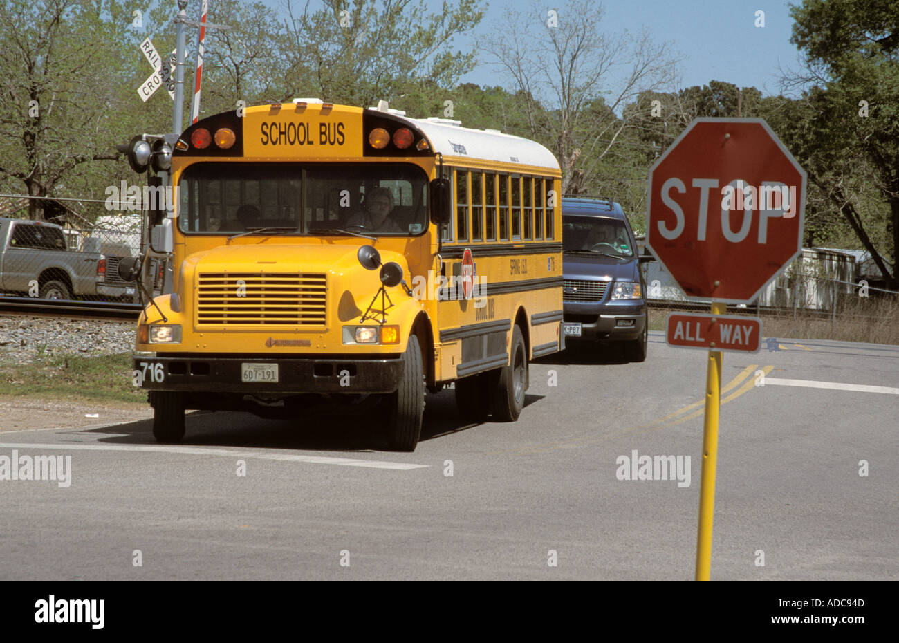 Old Town Spring Texas USA School bus on railway level crossing Railroad ...