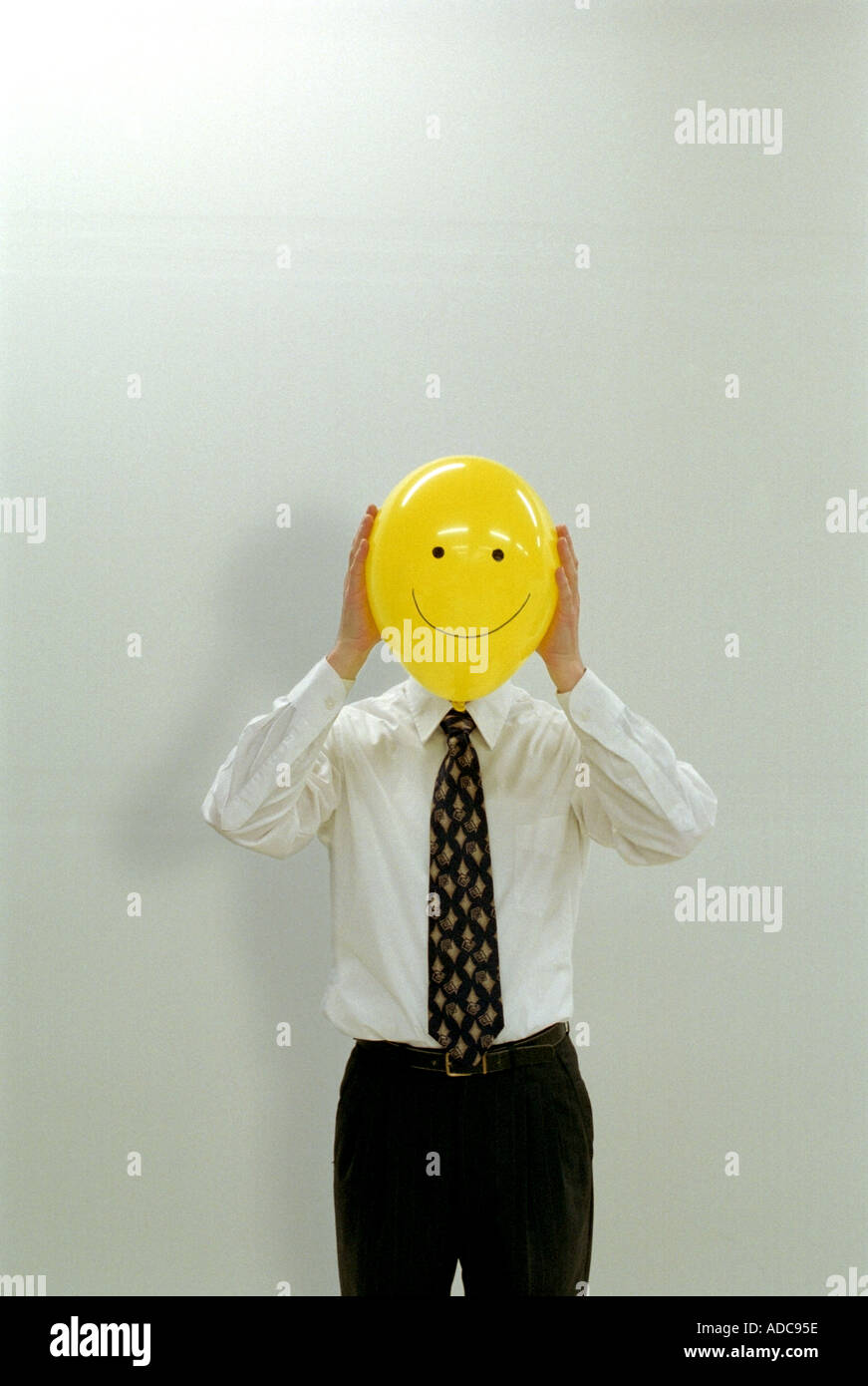 Businessman holding smiley face balloon SIMILAR IMAGES A30C74 ADC95F ...