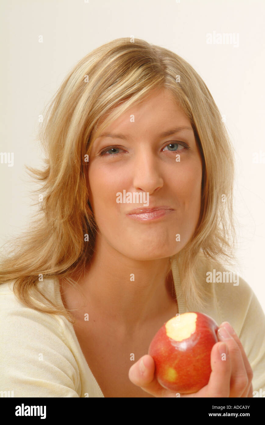 Portrait of Woman eating apple, chewing Stock Photo - Alamy