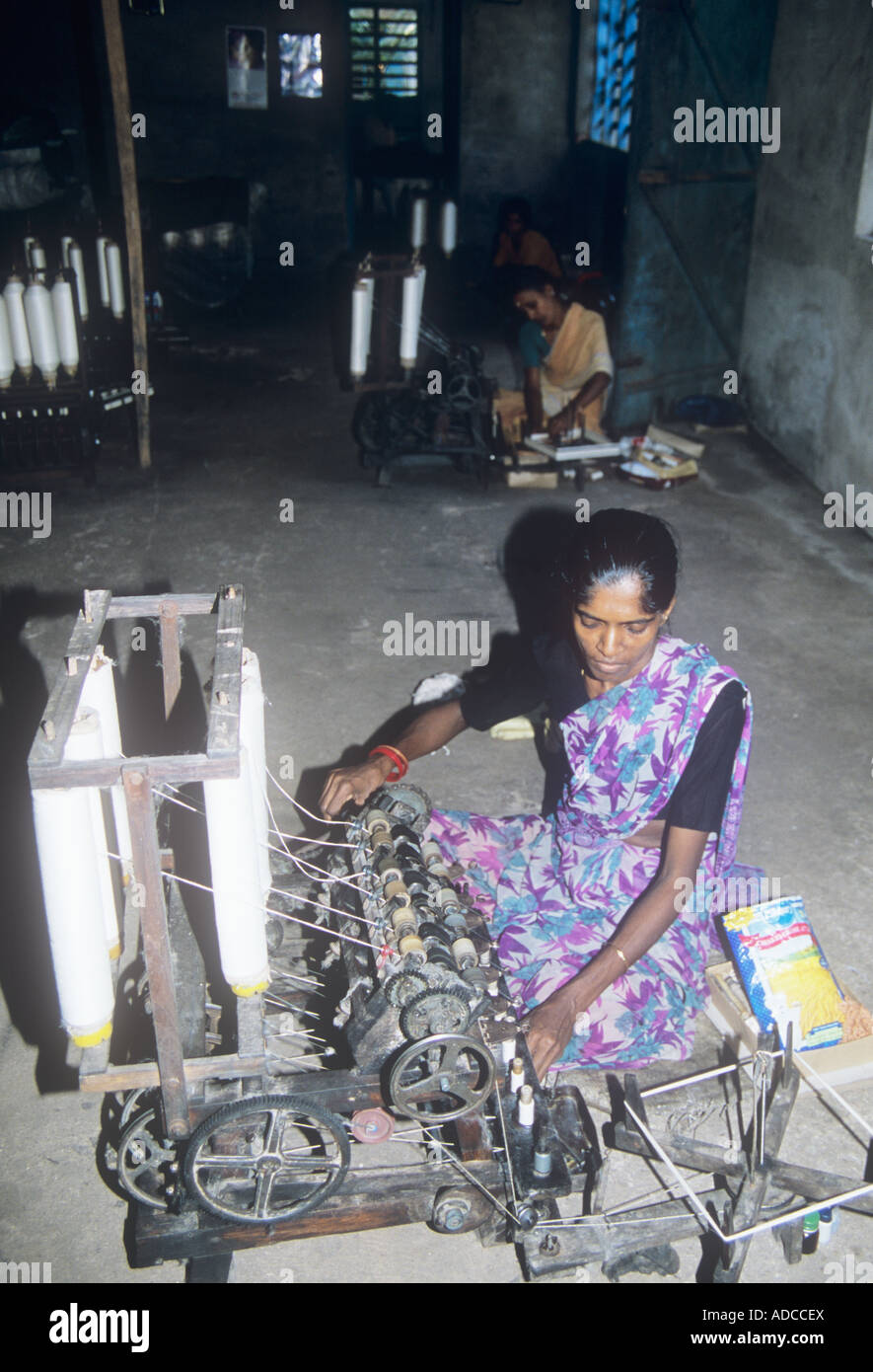 Women spinning cotton in a simple factory in Kerala India Stock Photo ...