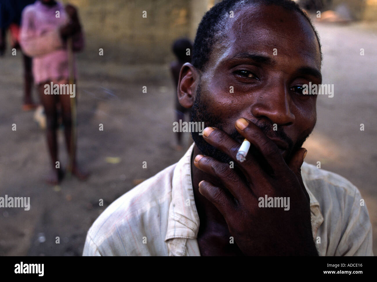 African man smoking hi-res stock photography and images - Alamy