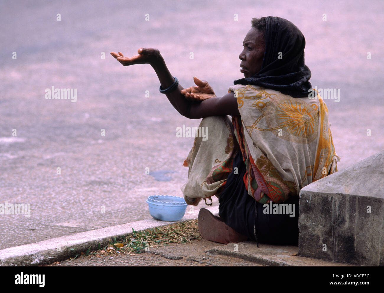 Woman begging in the street, Abidjan, Ivory Coast Stock Photo - Alamy