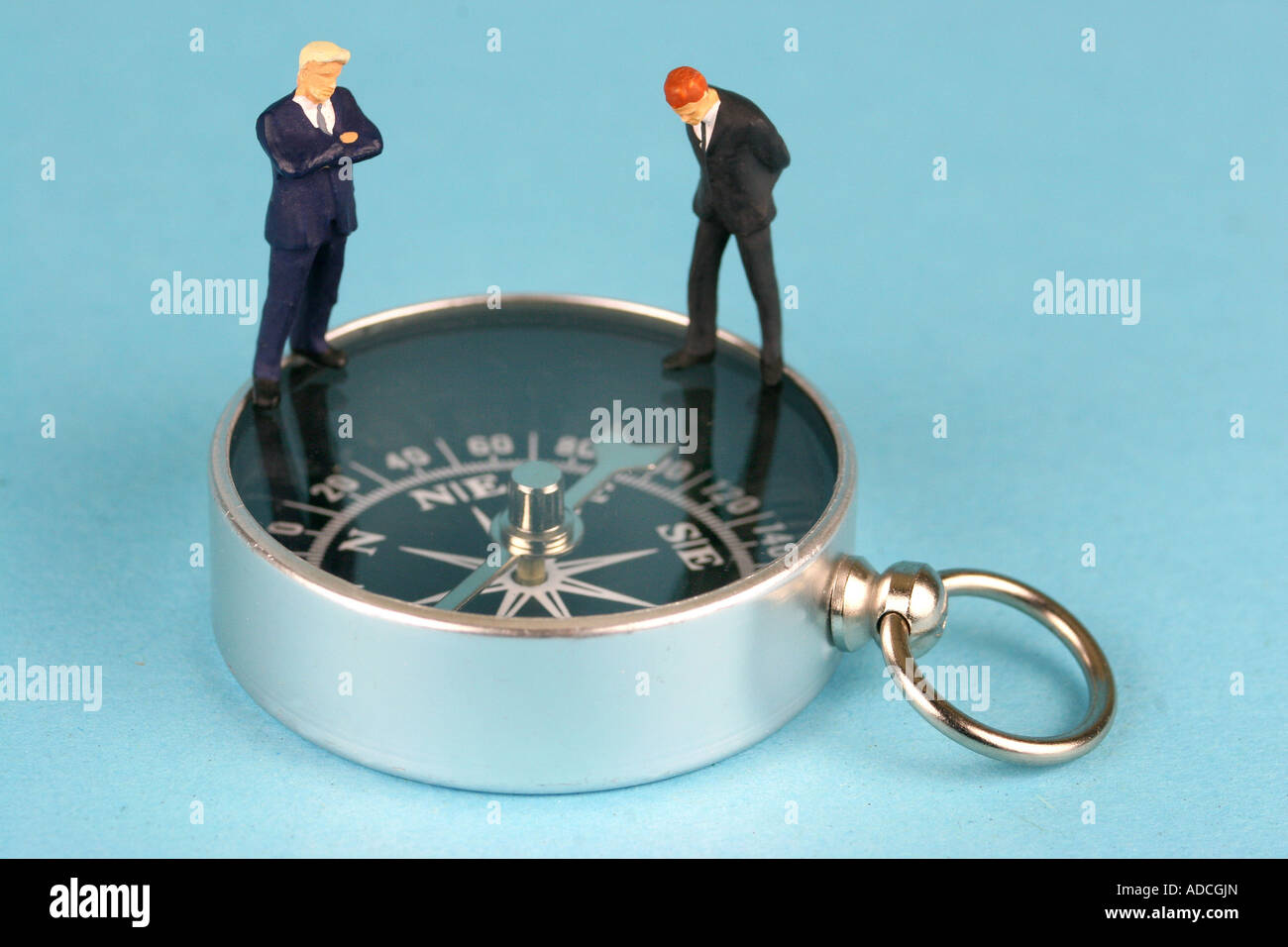 compass with figures Stock Photo - Alamy