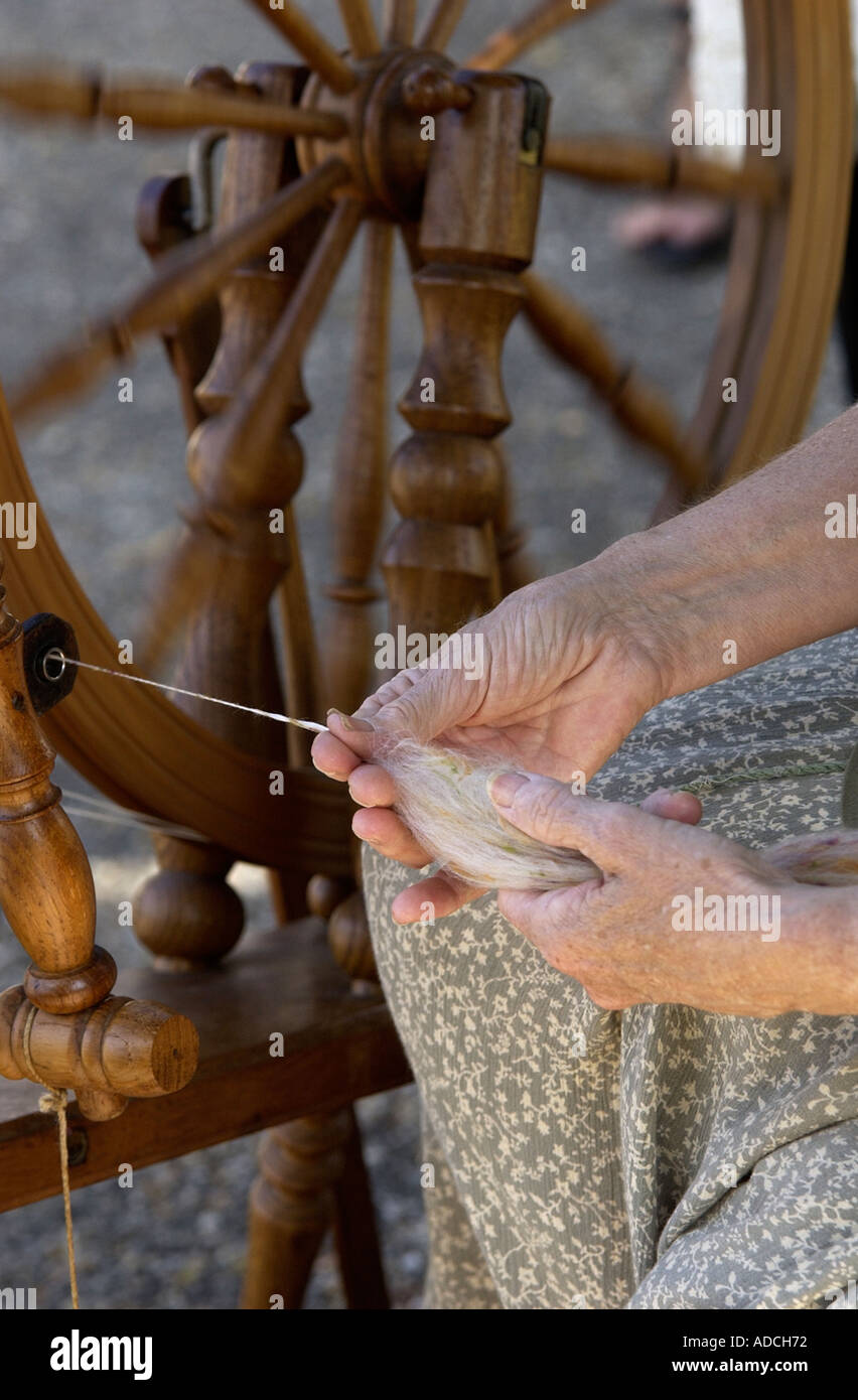 Lady spinning wool spinning wheel hi-res stock photography and images ...