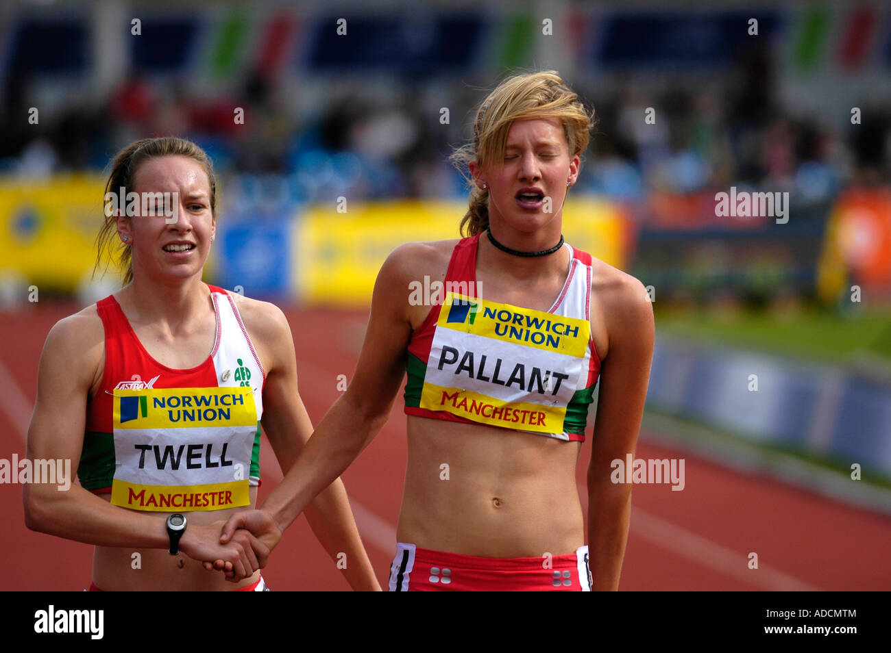 Exhausted runners congratulating each other at end of race Stock Photo ...