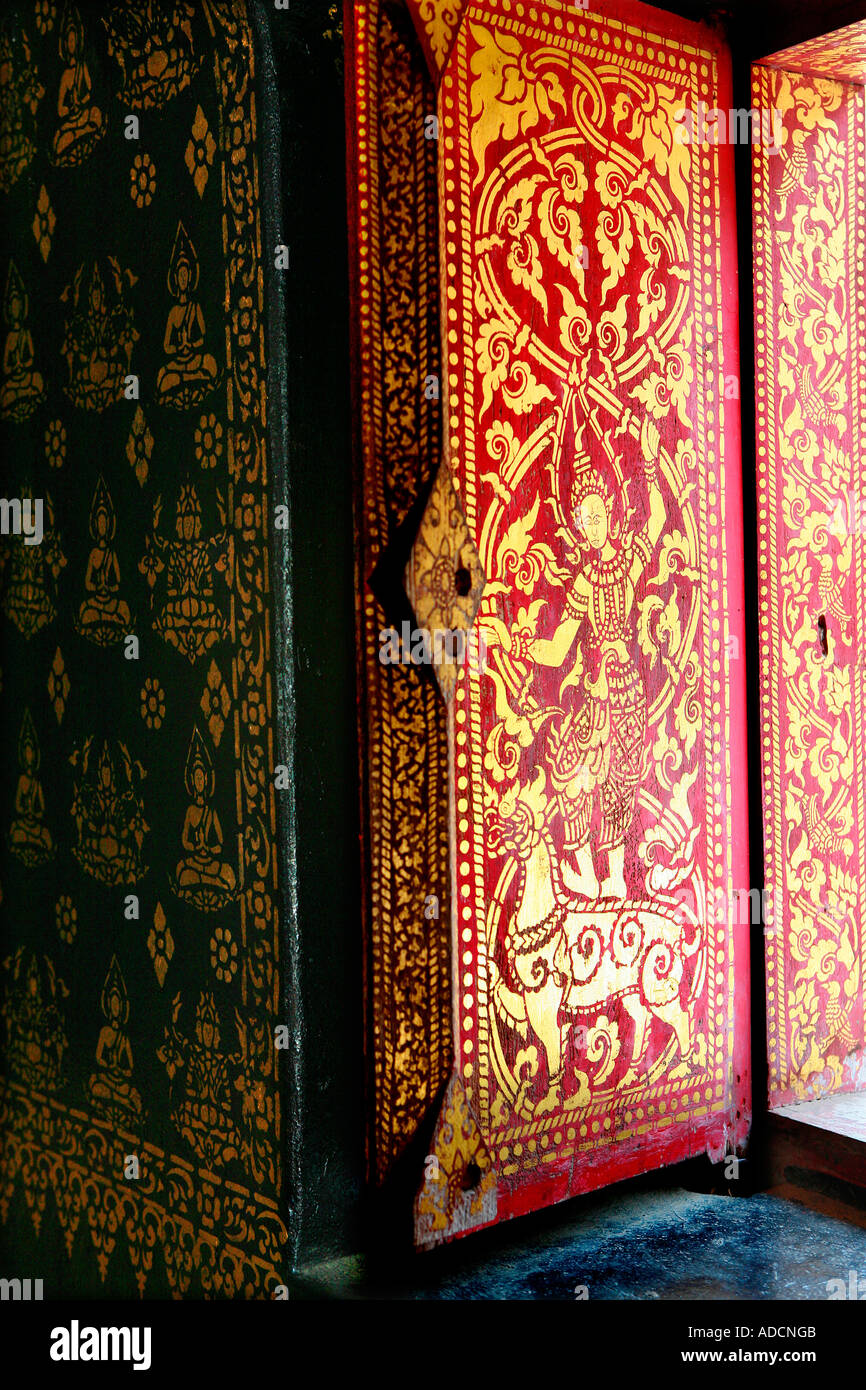 Carved and painted door at Wat Xieng Thong, Luang Prabang, Laos Stock ...