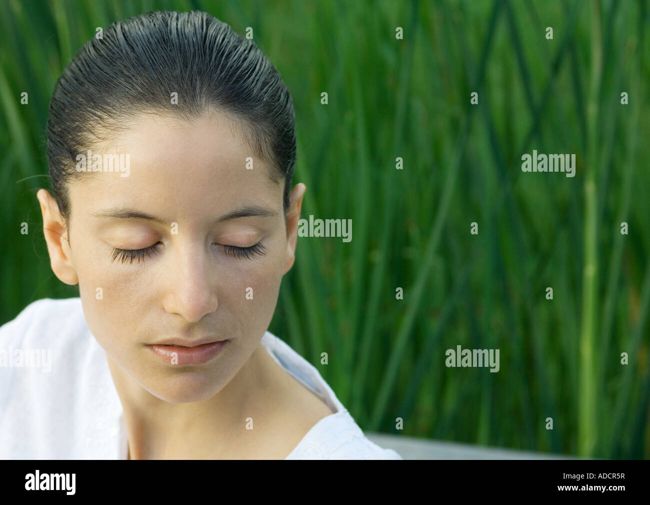 Woman with eyes closed, head and shoulders, portrait Stock Photo - Alamy