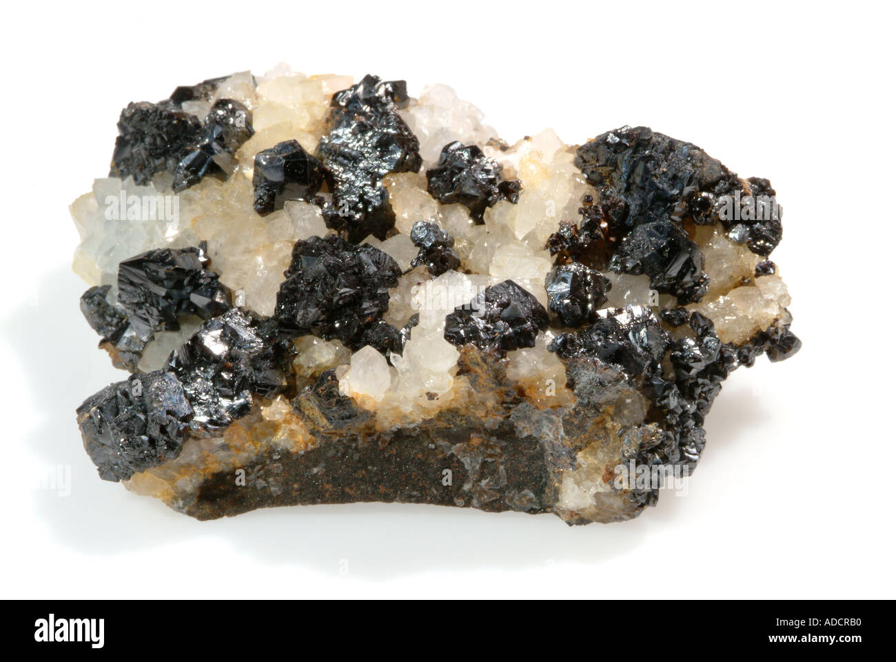 Mineral Sphalerite, Small jet-black shiny crystals sitting on a bed of ...