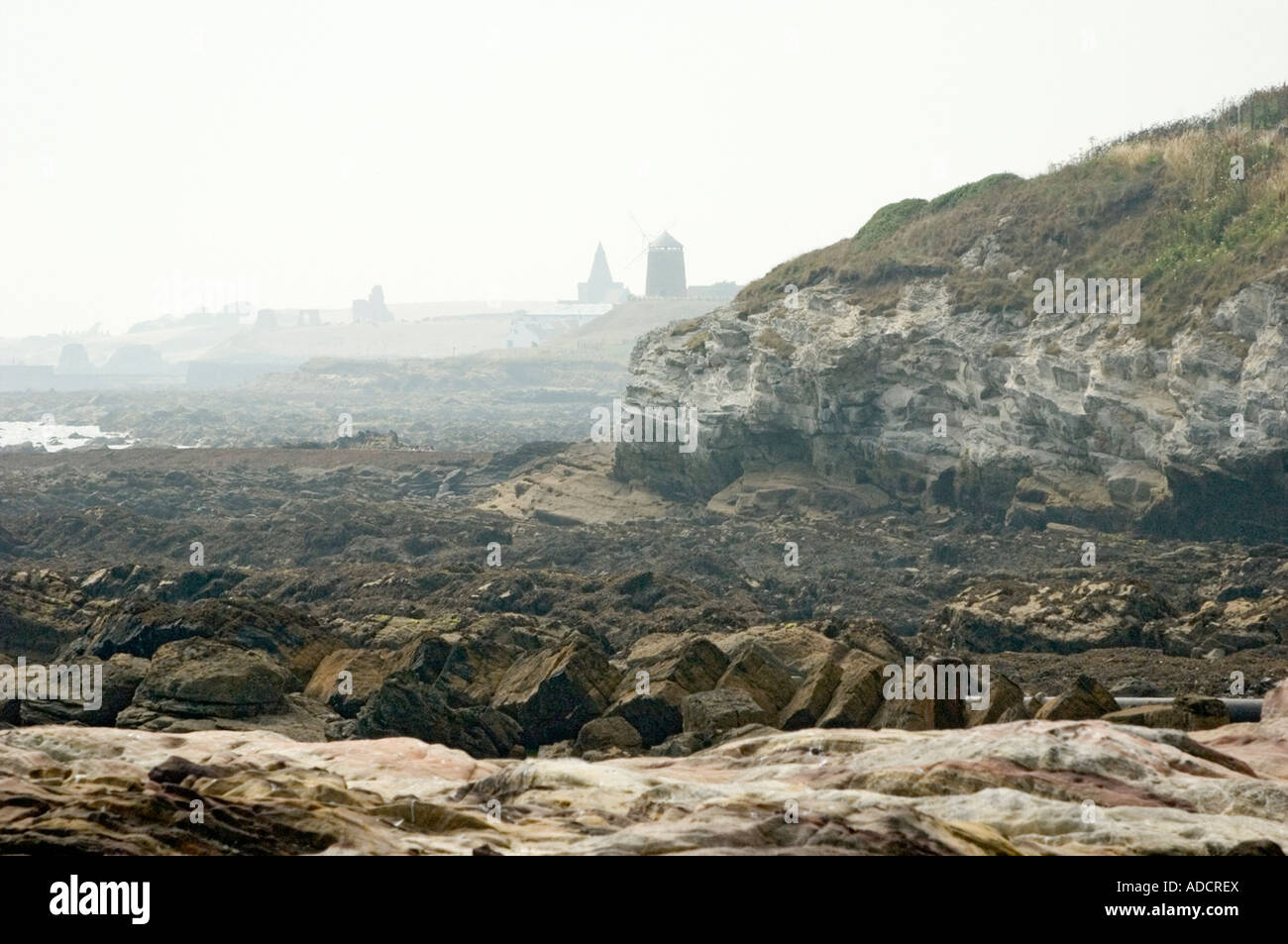 Misty view of St Monans windmill castle and church from Pittenweem Fife ...