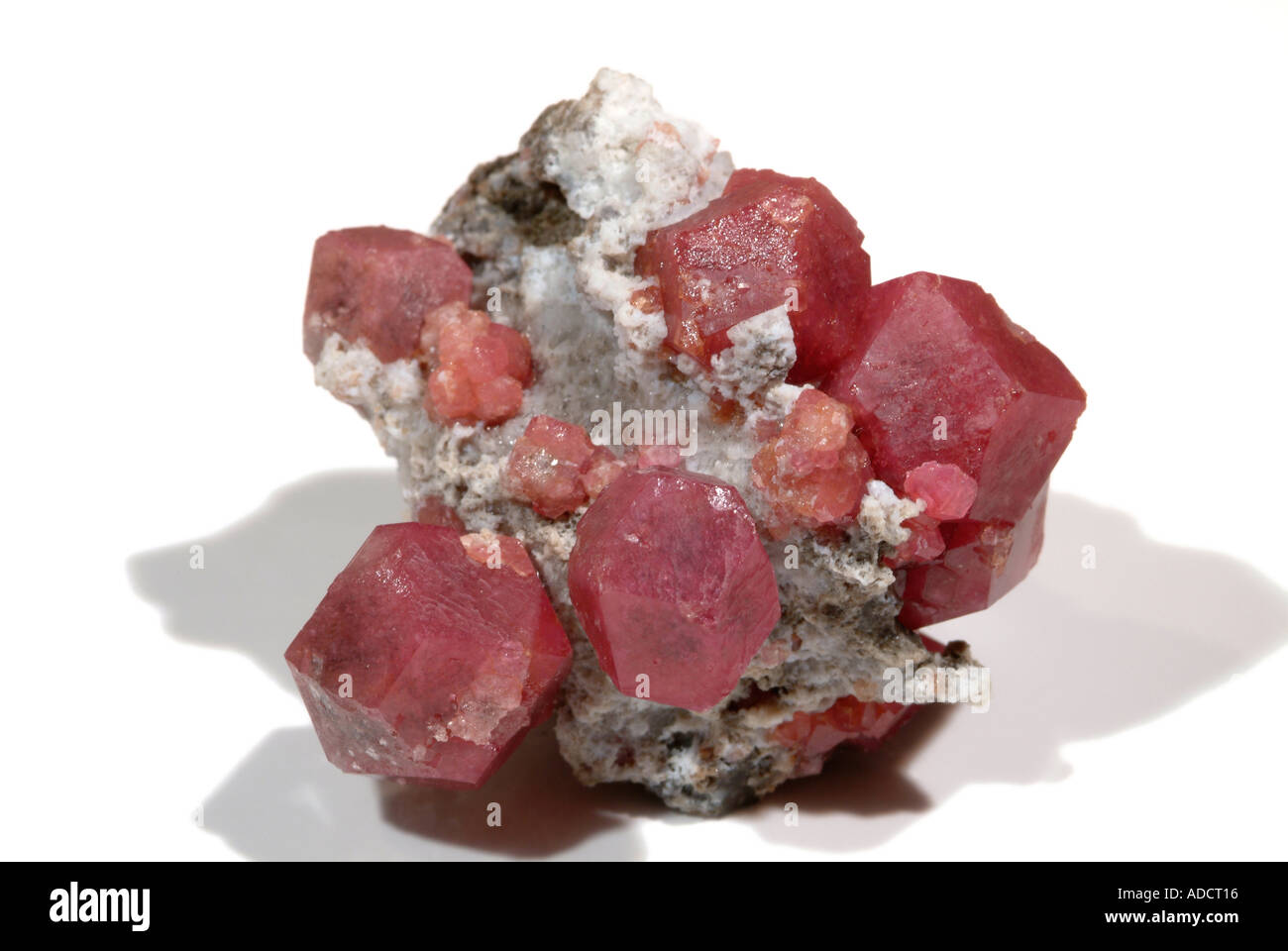 Mineral Grossular, Large pink crystals grouped on a quartz-granite ...