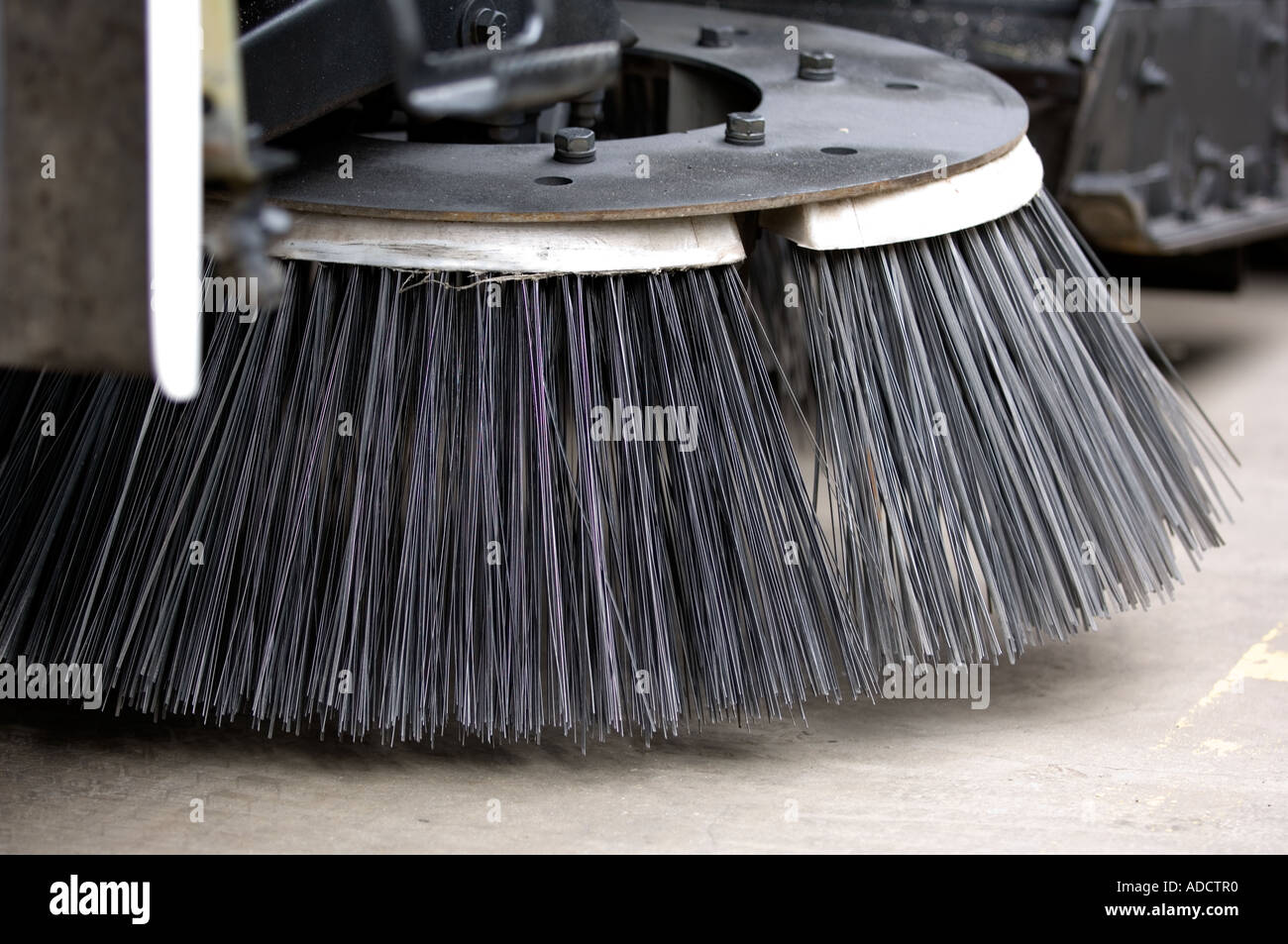 Street sweeping truck cleaning street. Details closeup of brushes Stock ...