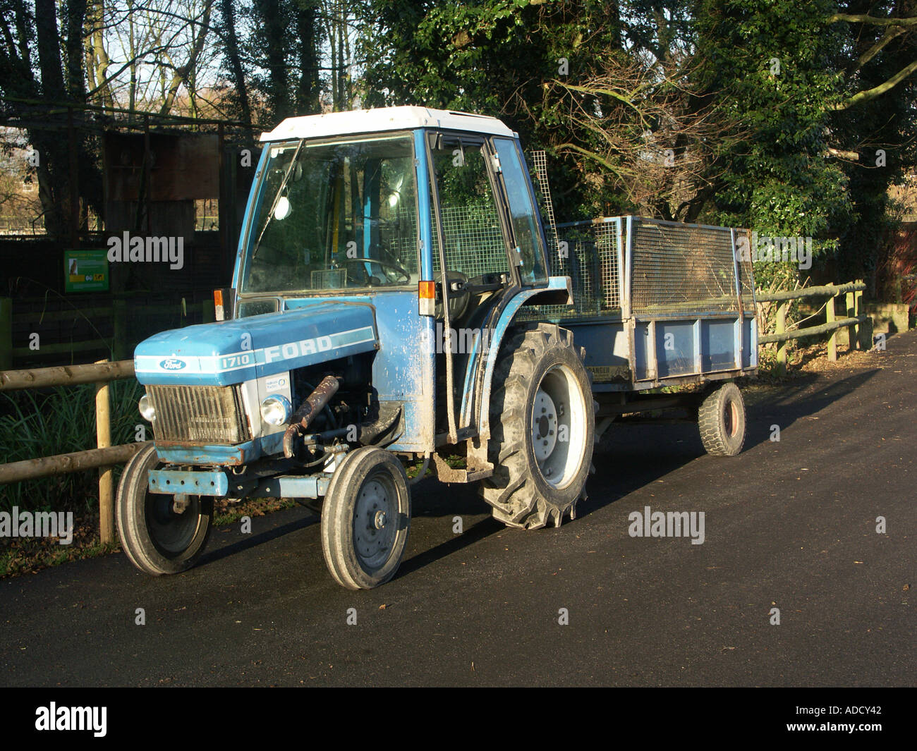 Ford 1710 Tractor in use at a zoo Stock Photo - Alamy