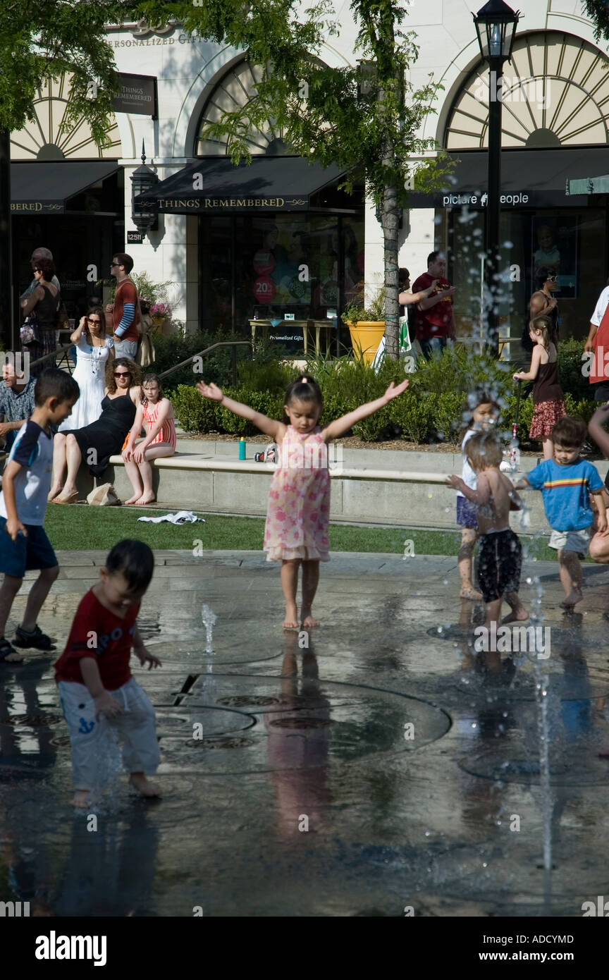 Kids playing and getting wet outside during the summer of 2006 heat ...