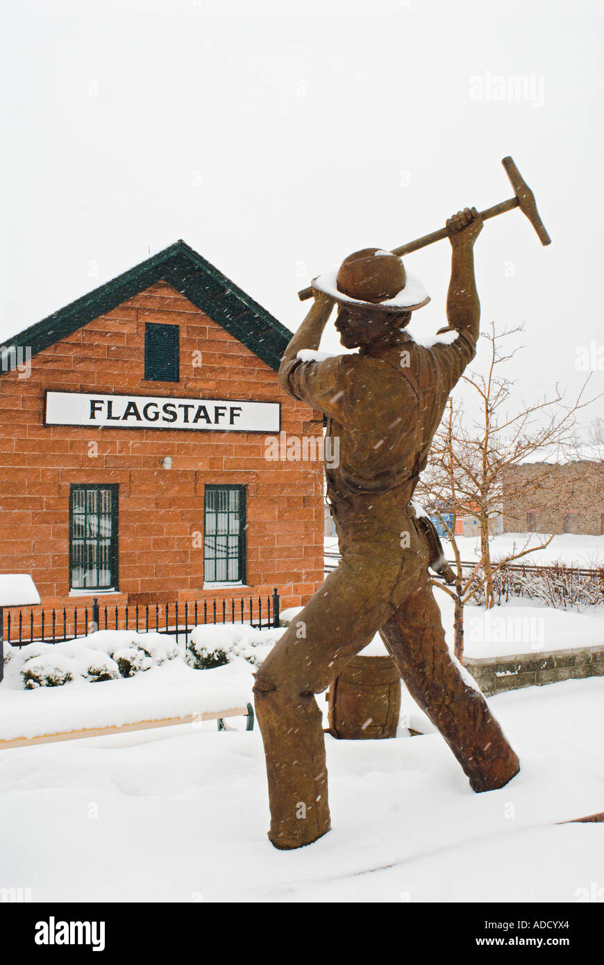 Gandy Dancer bronze sculpture wears winter snow in downtown Flagstaff ...