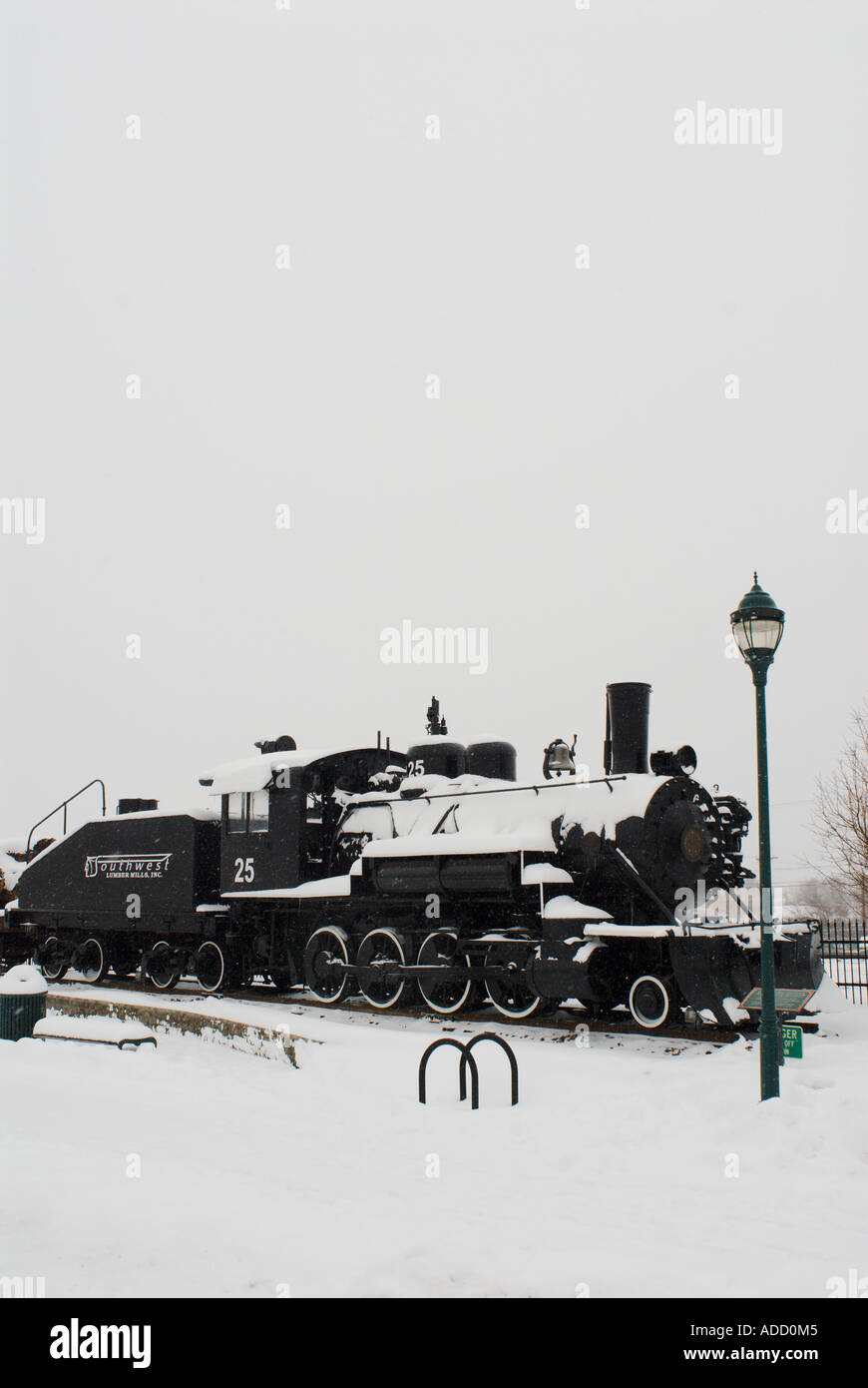 Baldwin steam engine Number 25 in a winter snow storm in downtown ...