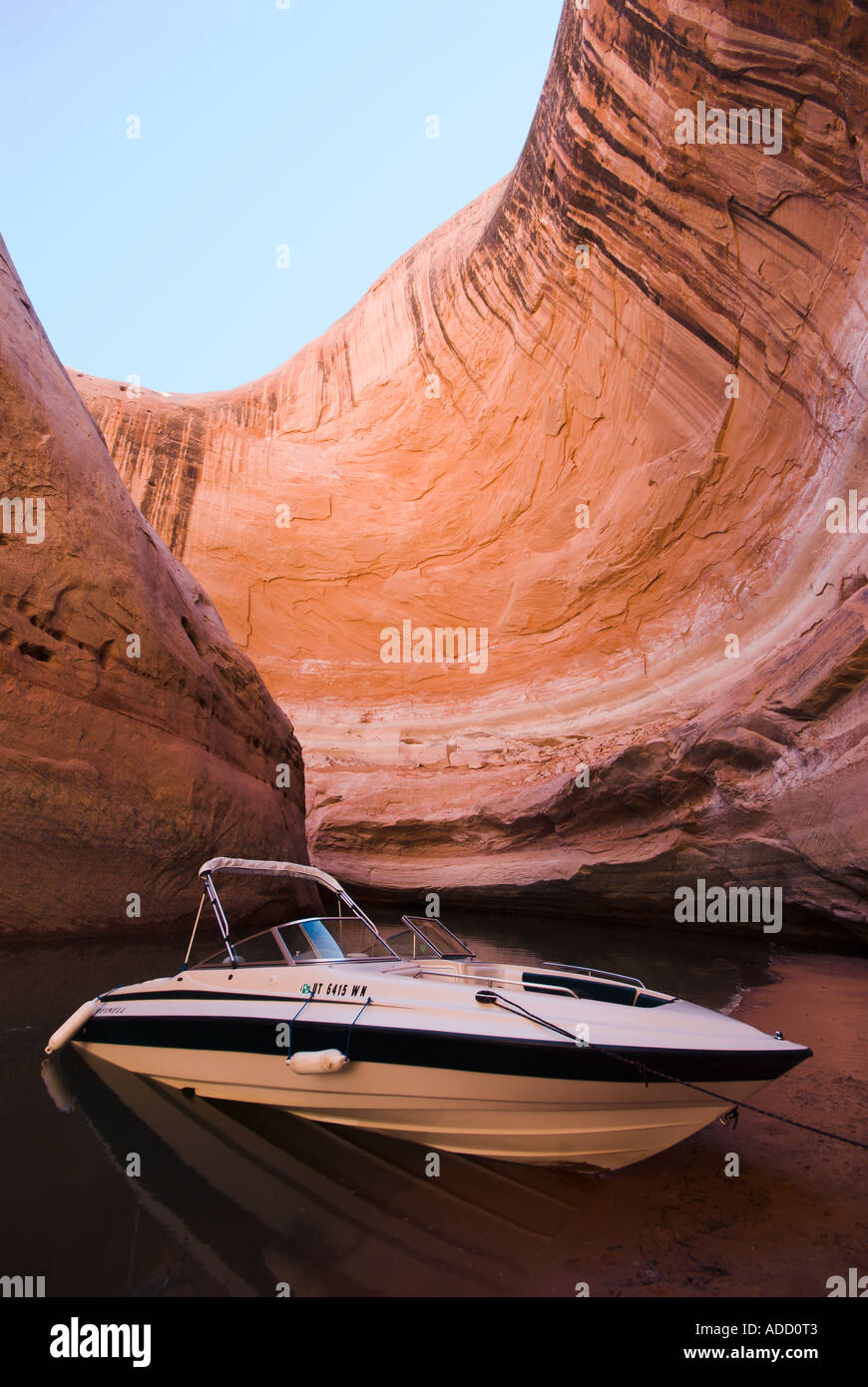 A speedboat adds more graceful curves to the scene at Lake Powell A ...