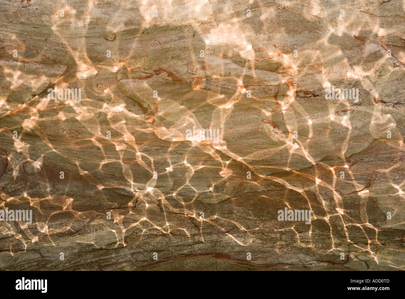 Sunlight reflects on the rock walls of Lake Powell A part of the Glen ...