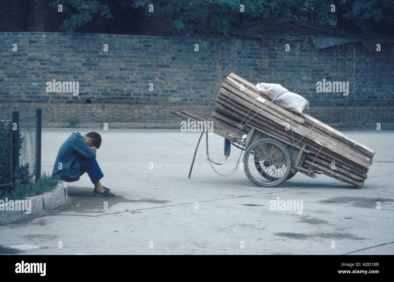 china man transport have a break Stock Photo - Alamy
