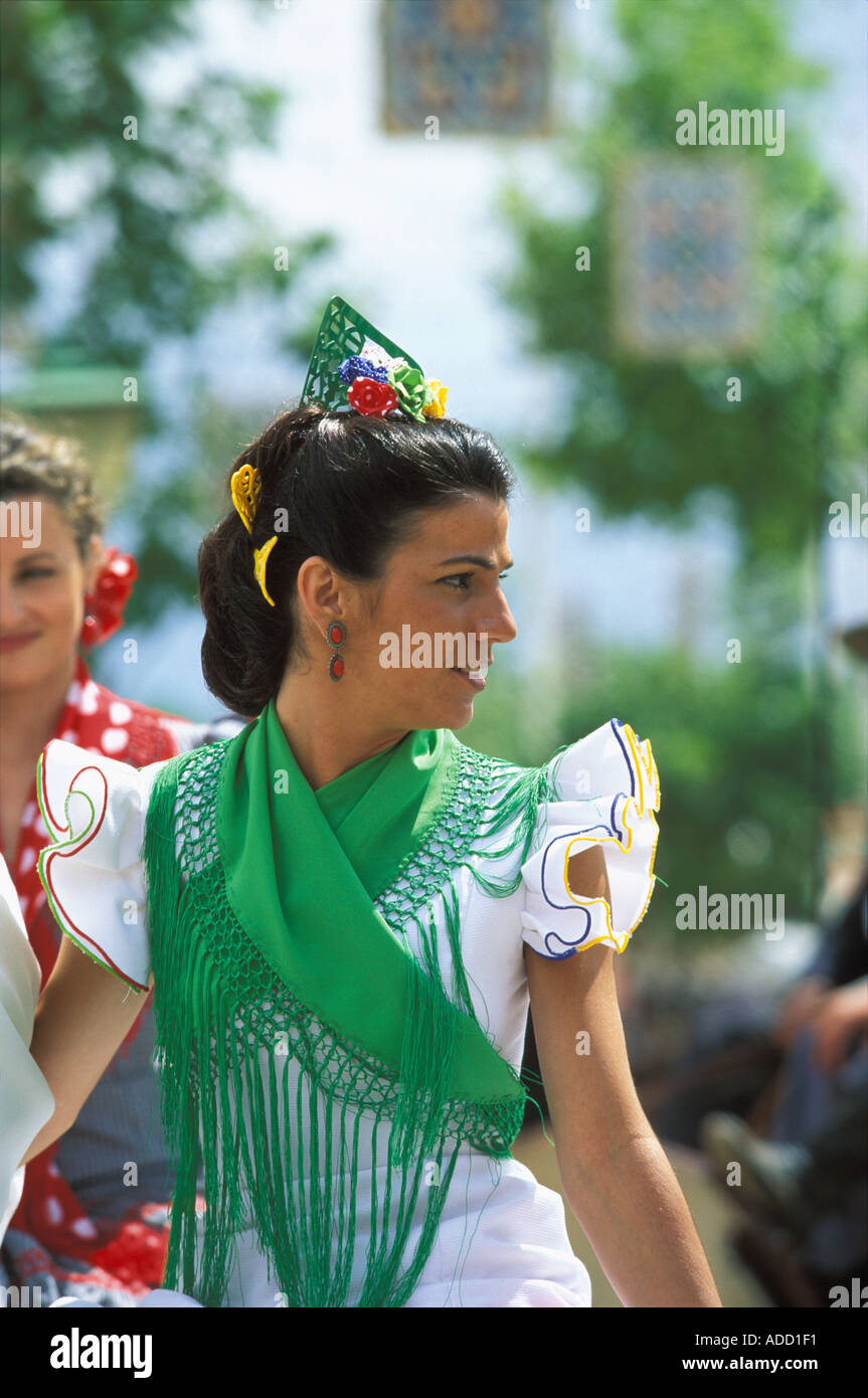 Woman in traditional Andalucian clothes attending the April Fair of ...