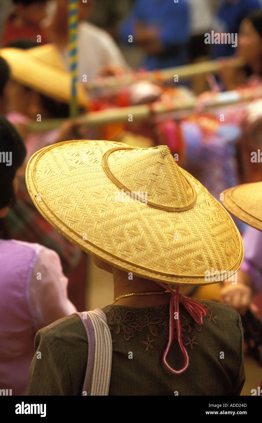 Shan woman wearing a traditional bamboo hat at Poy Sang Long the yearly ...