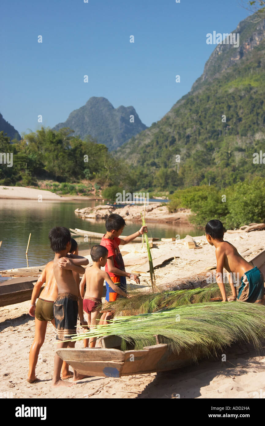 Kids playing on river bank hi-res stock photography and images - Alamy